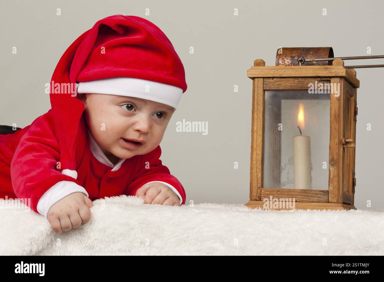 Little baby dressed up as Father Christmas. Toddler dressed as Santa ...