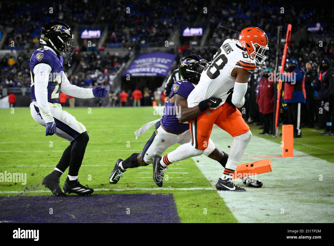Cleveland Browns tight end Jordan Akins, right, scores past Baltimore ...