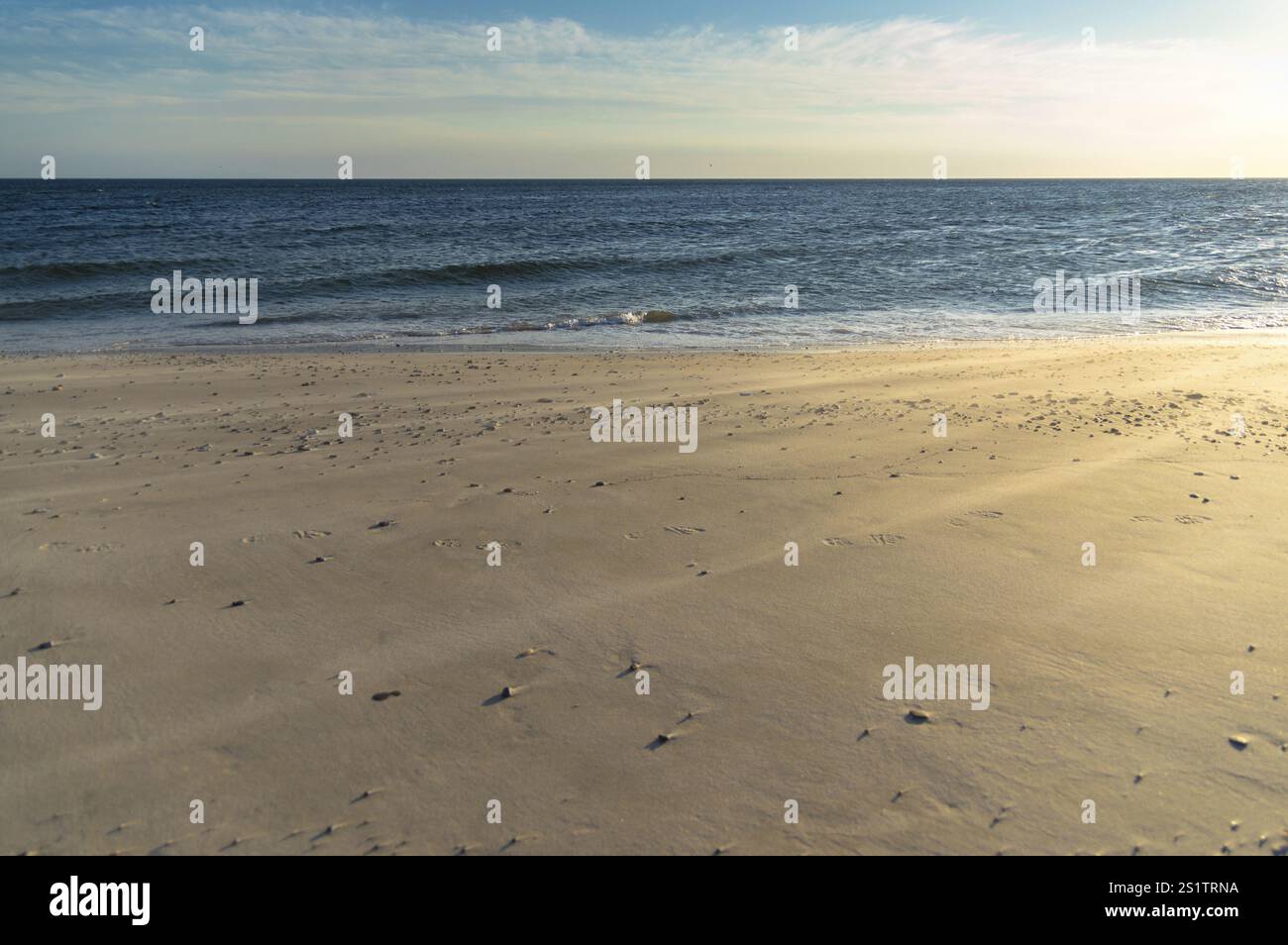 Seaside in Denmark with sandy beach and light waves in the sea. Seaside ...