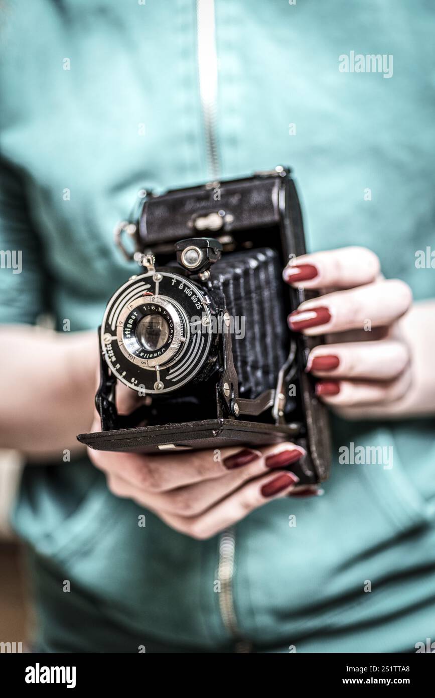 Old, historic, black camera with manual setting and concertina lens ...