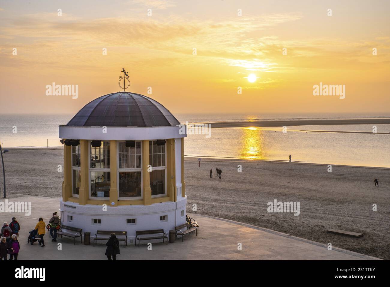 Sunset over the music pavilion of Borkum with beautiful golden light ...