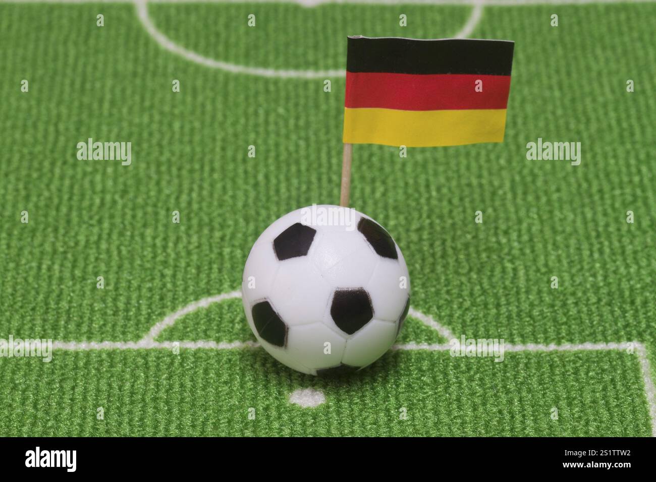 Football with German flag on football pitch mat Stock Photo - Alamy