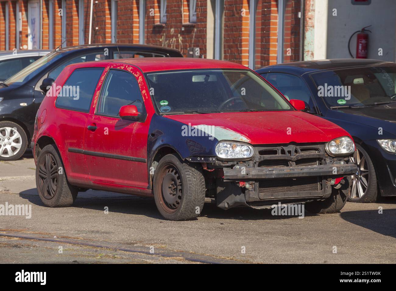 Red wrecked VW Golf standing in a car park, Germany, Europe Stock Photo ...