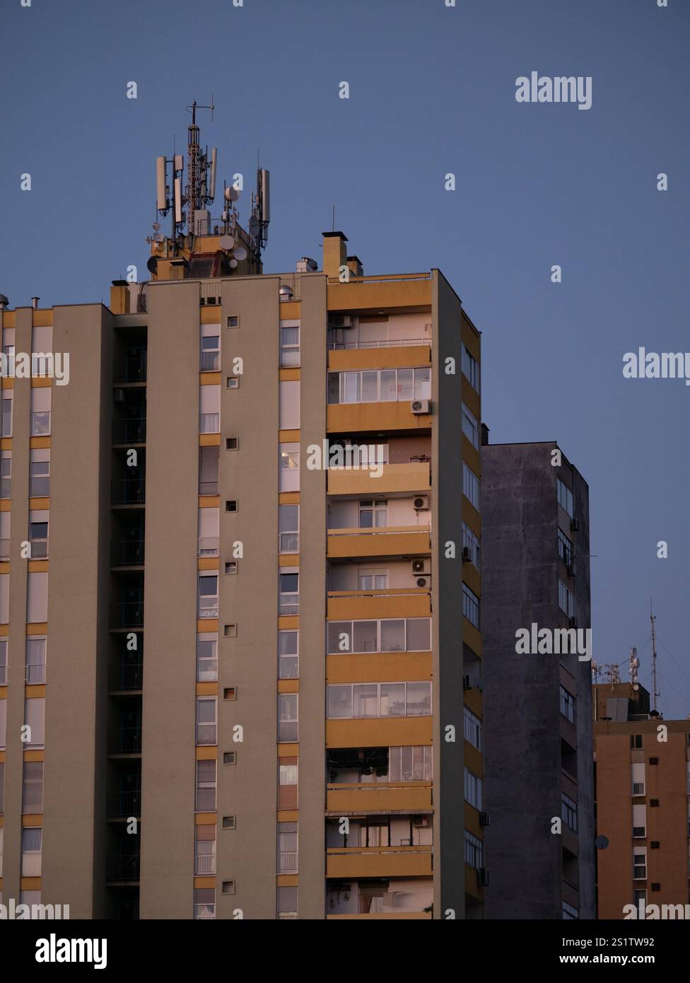 Cellular antennas and transmitters on roof of residential building ...