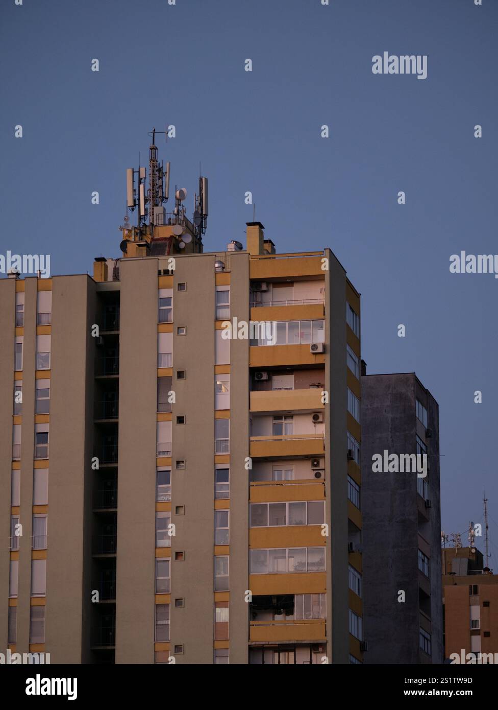 Cellular antennas and transmitters on roof of residential building ...