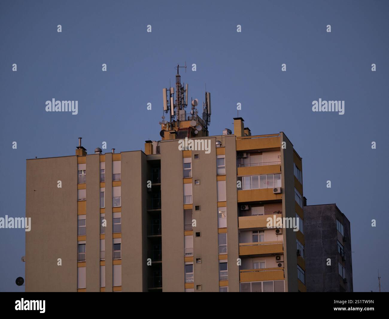 Cellular antennas and transmitters on roof of residential building ...