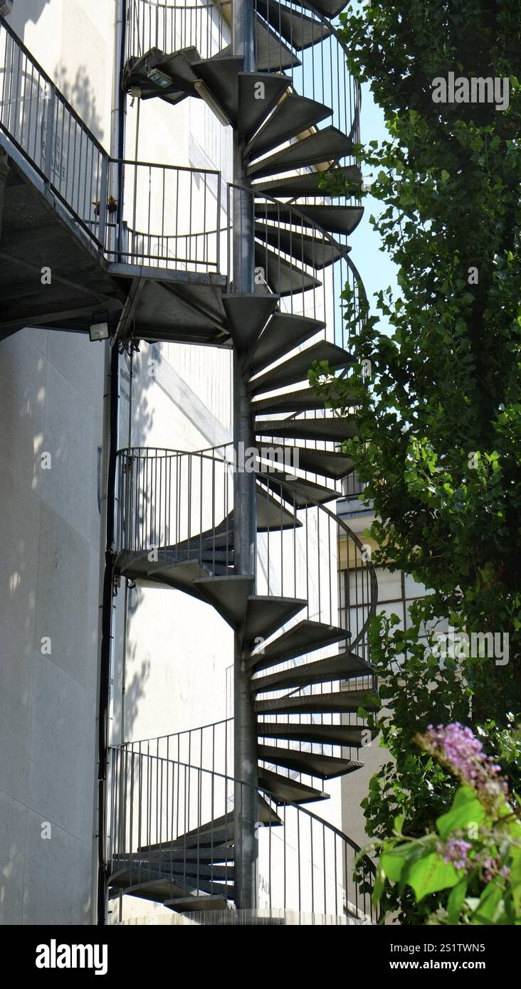 House wall with an attached free-standing external spiral staircase ...
