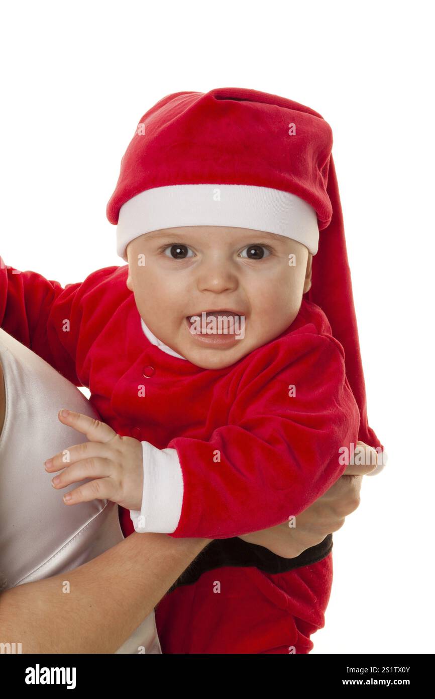 Little baby dressed up as Father Christmas. Toddler dressed as Santa ...
