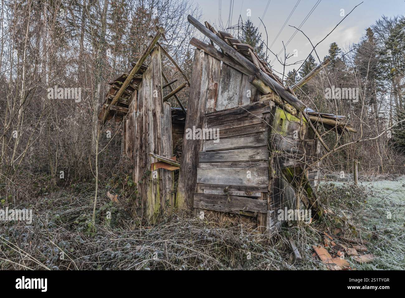 A small wooden hut that is falling apart and was once used for farming ...