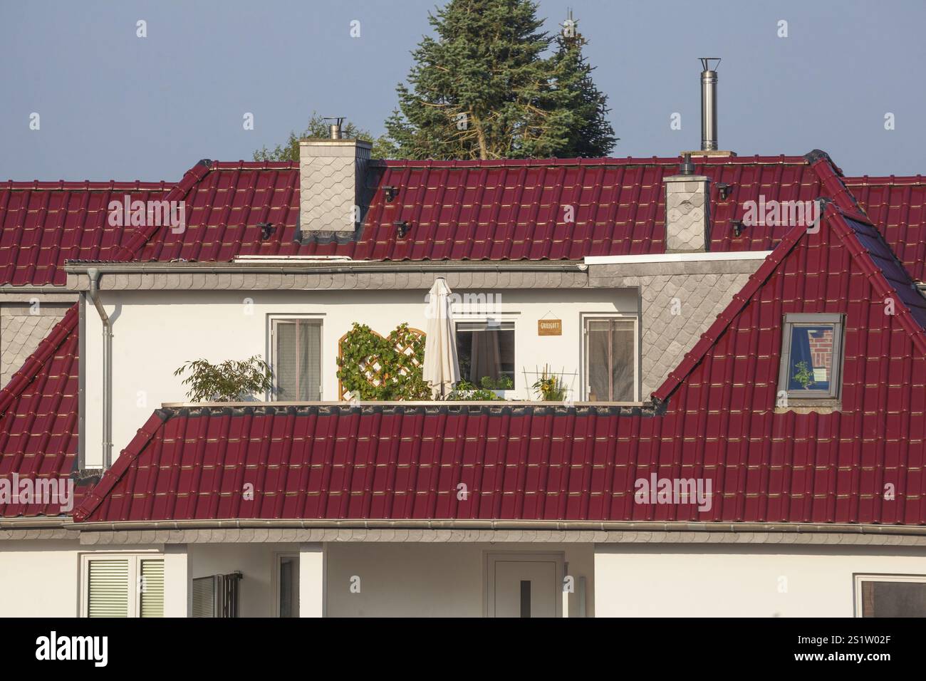 Modern residential building rear view with roof and balcony, apartment ...
