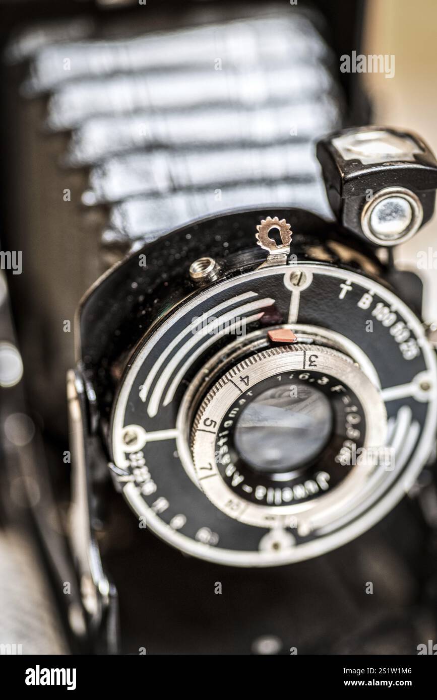 Old, historic, black camera with manual setting and concertina lens ...