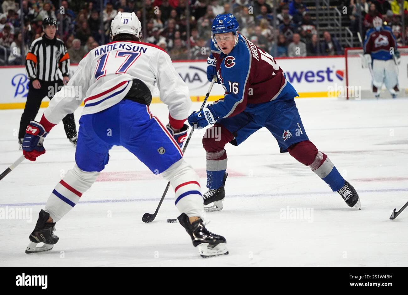 Colorado Avalanche center Juuso Parssinen, back, looks to pass the puck ...