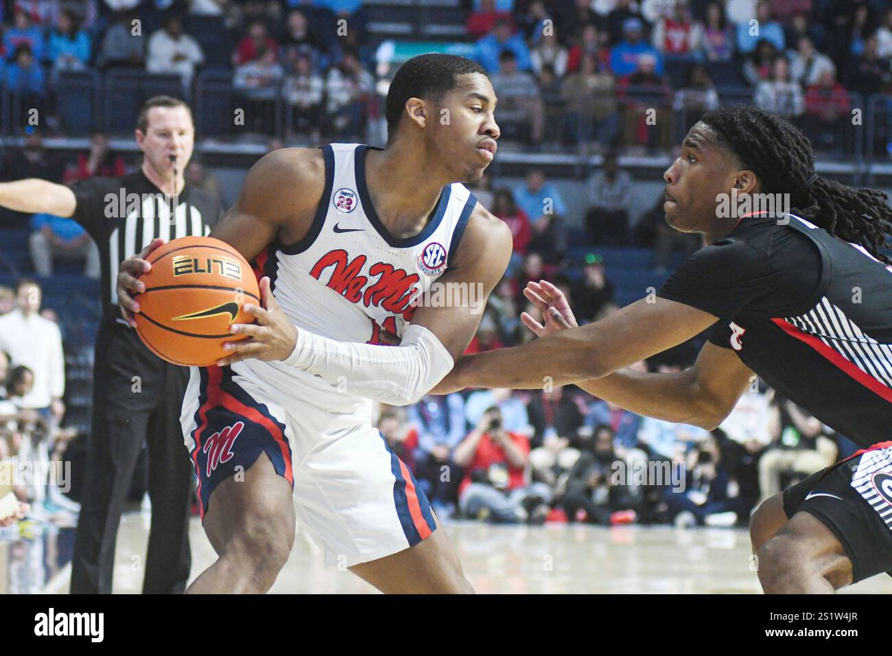 Mississippi guard Matthew Murrell (11) is guarded by Georgia guard ...