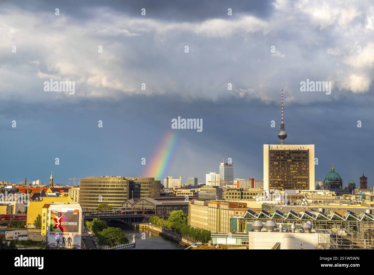 Rainbow over Berlin skyline with television tower in the background and ...