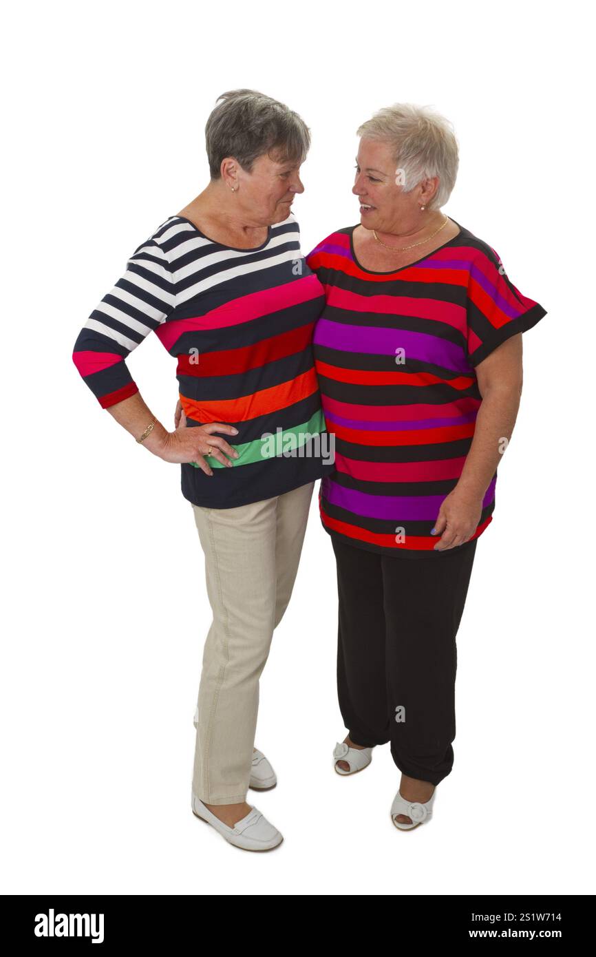 Two senior citizens standing - cropped on a white background Stock ...