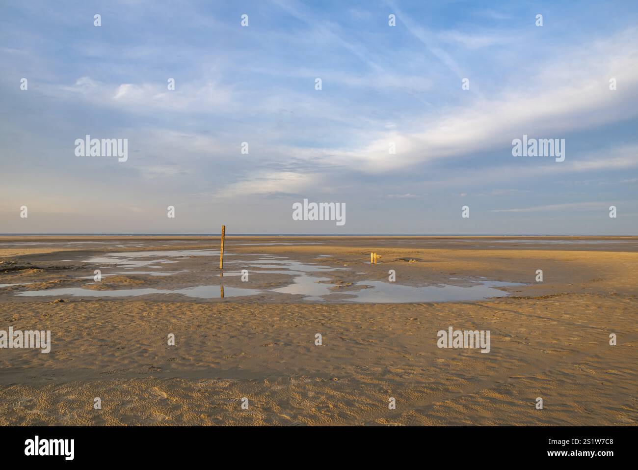 Wide horizon on the beach with puddles of water and an interesting ...