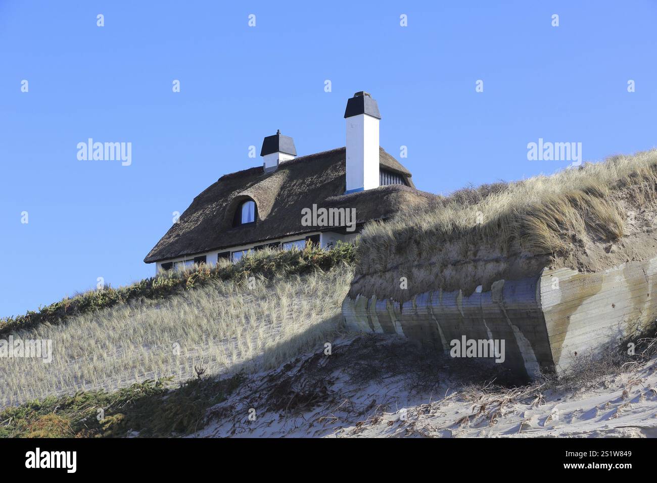 Thatched house and collapsed bunker of the German Wehrmacht on the ...