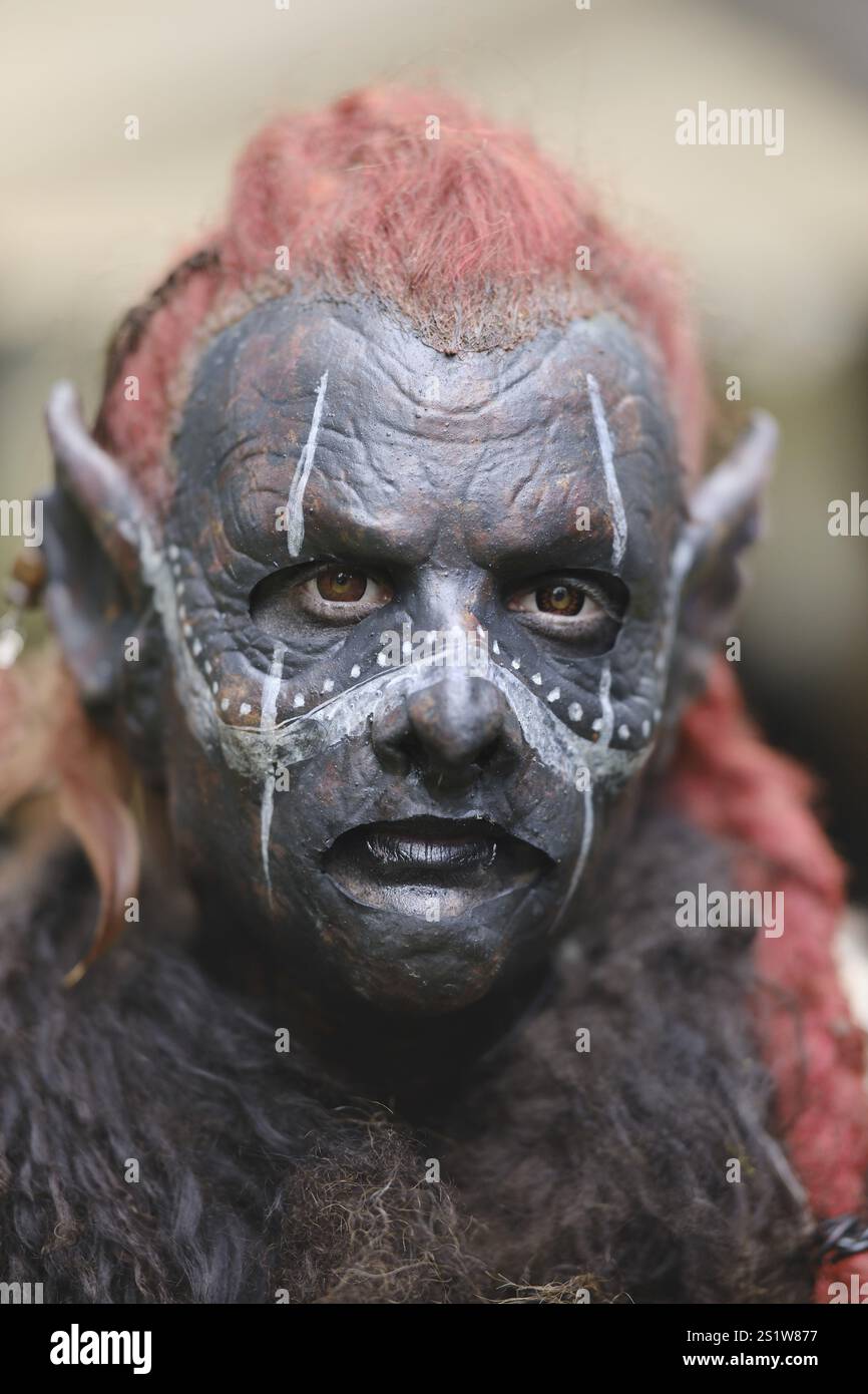Character with red hair and decorated face paint Stock Photo - Alamy