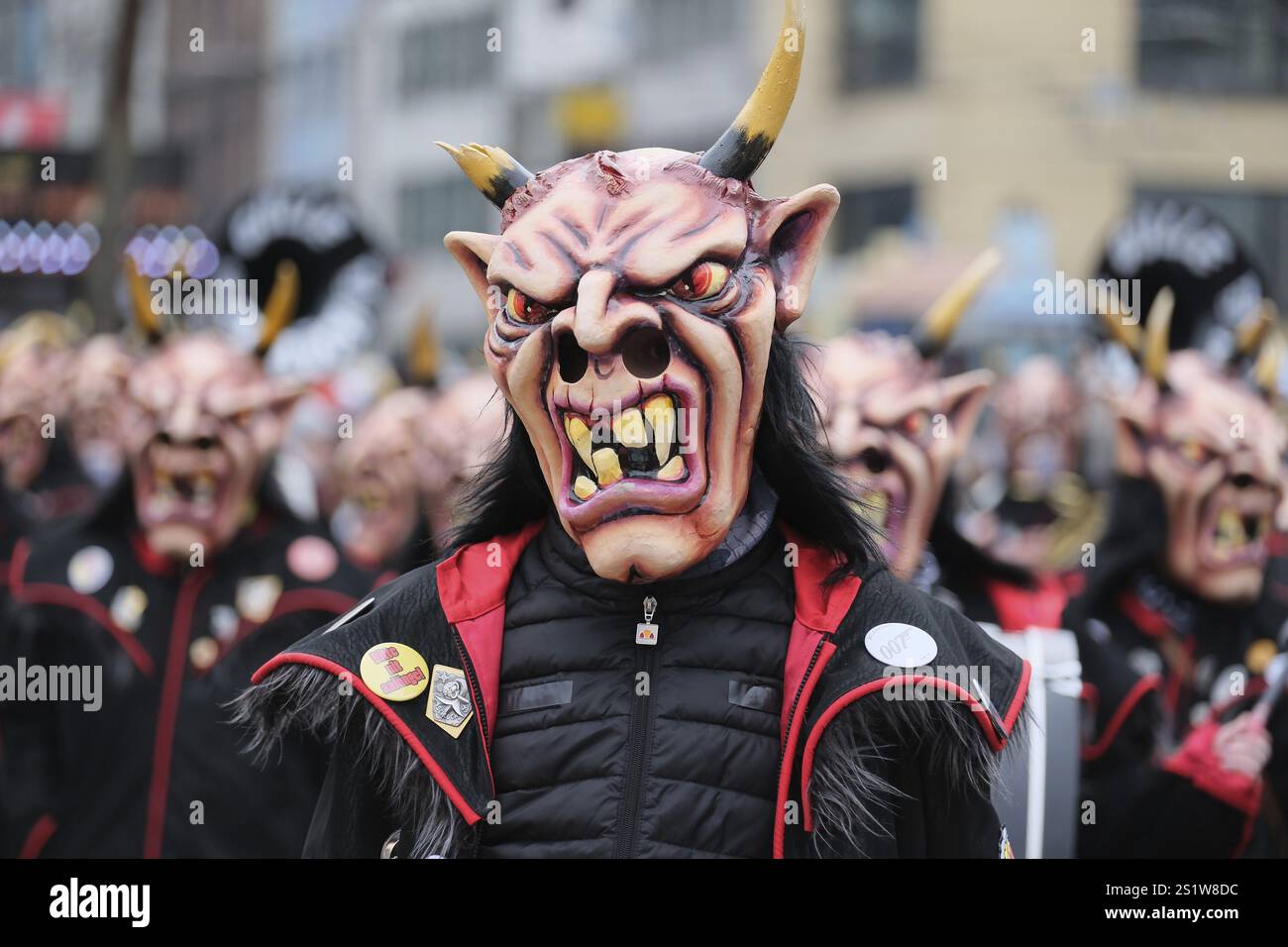 Devilish figures with horns and scary masks at carnival parade Stock ...