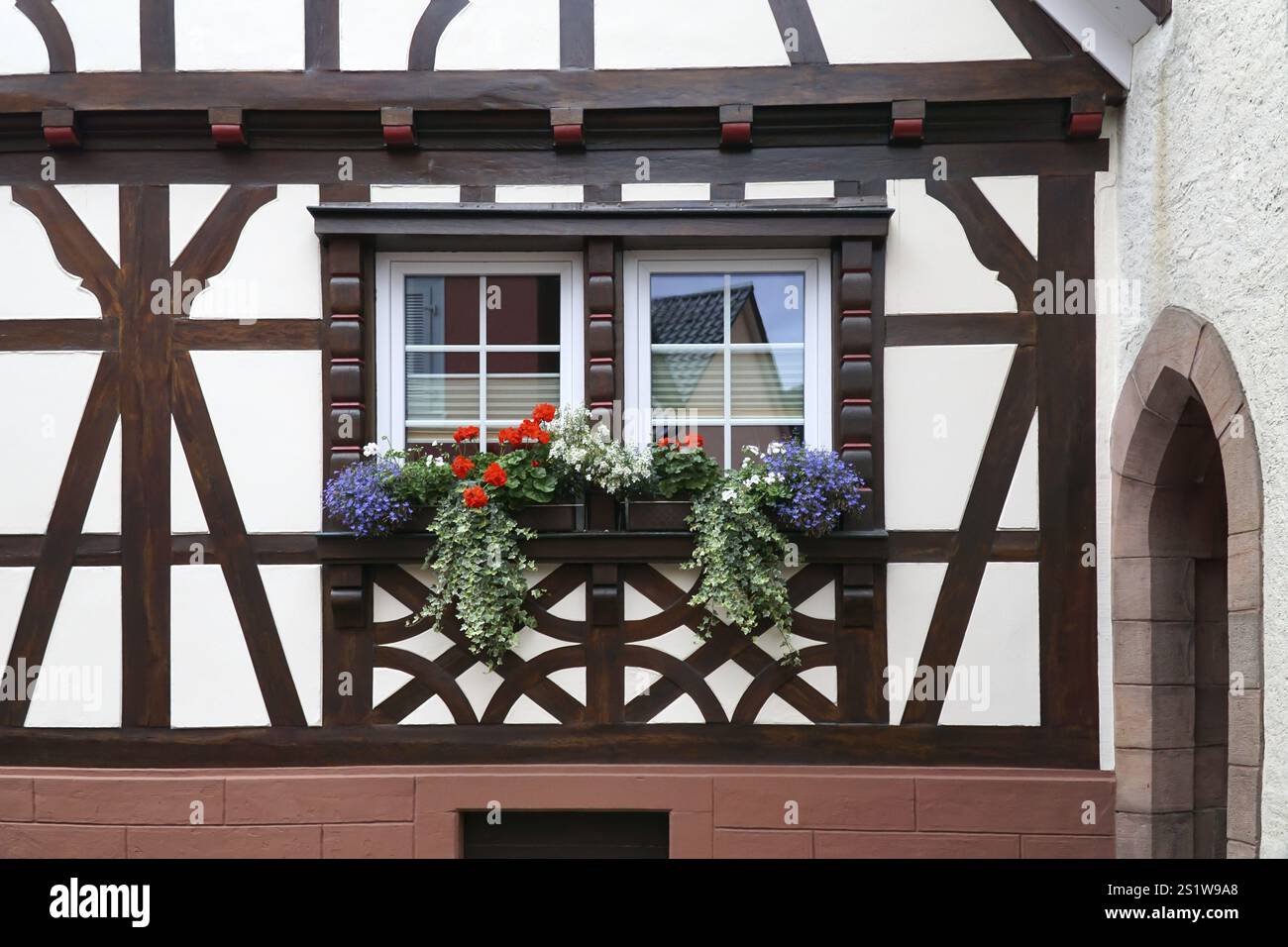 Wooden window with floral decoration on a half-timbered house in ...