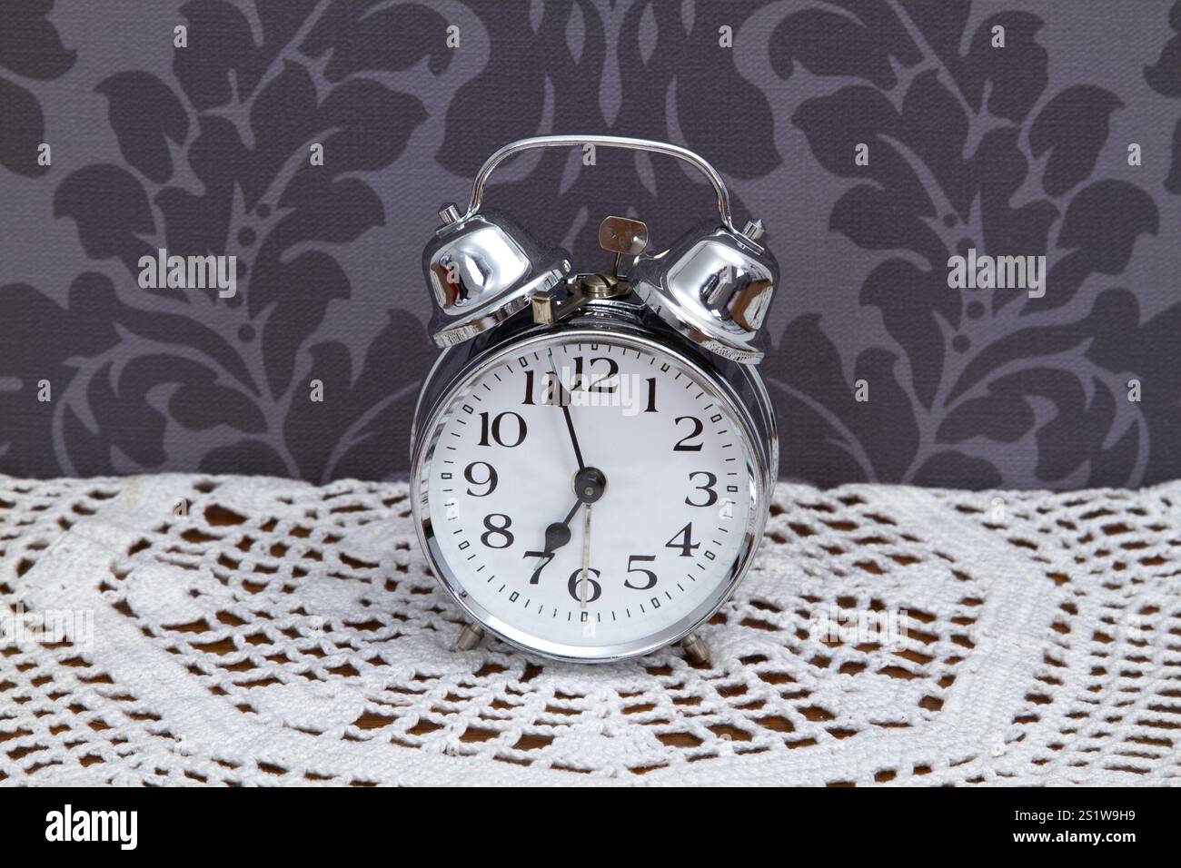 Nostalgic alarm clock on crochet blanket Stock Photo - Alamy