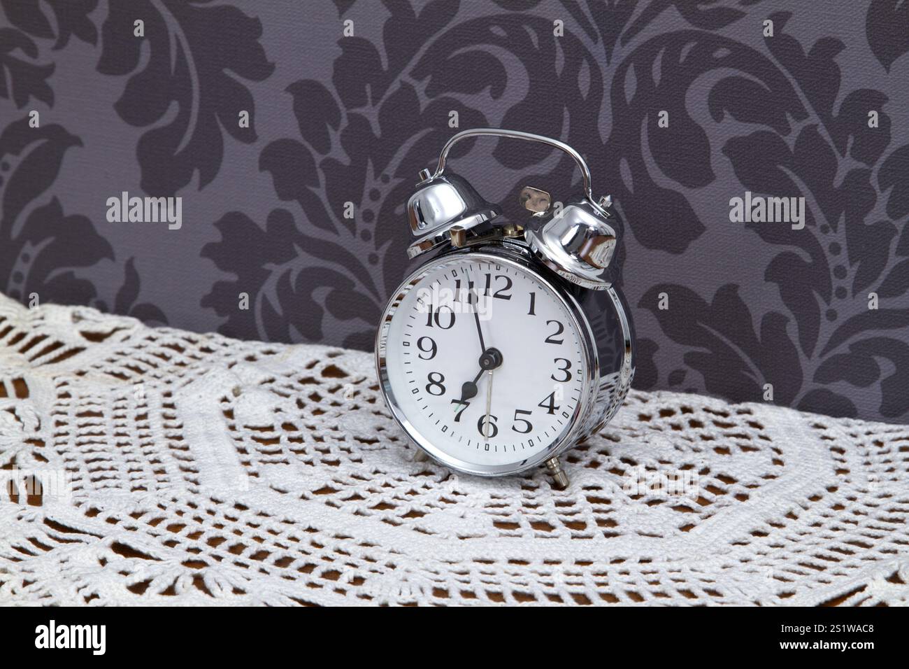 Nostalgic alarm clock on crochet blanket Stock Photo - Alamy