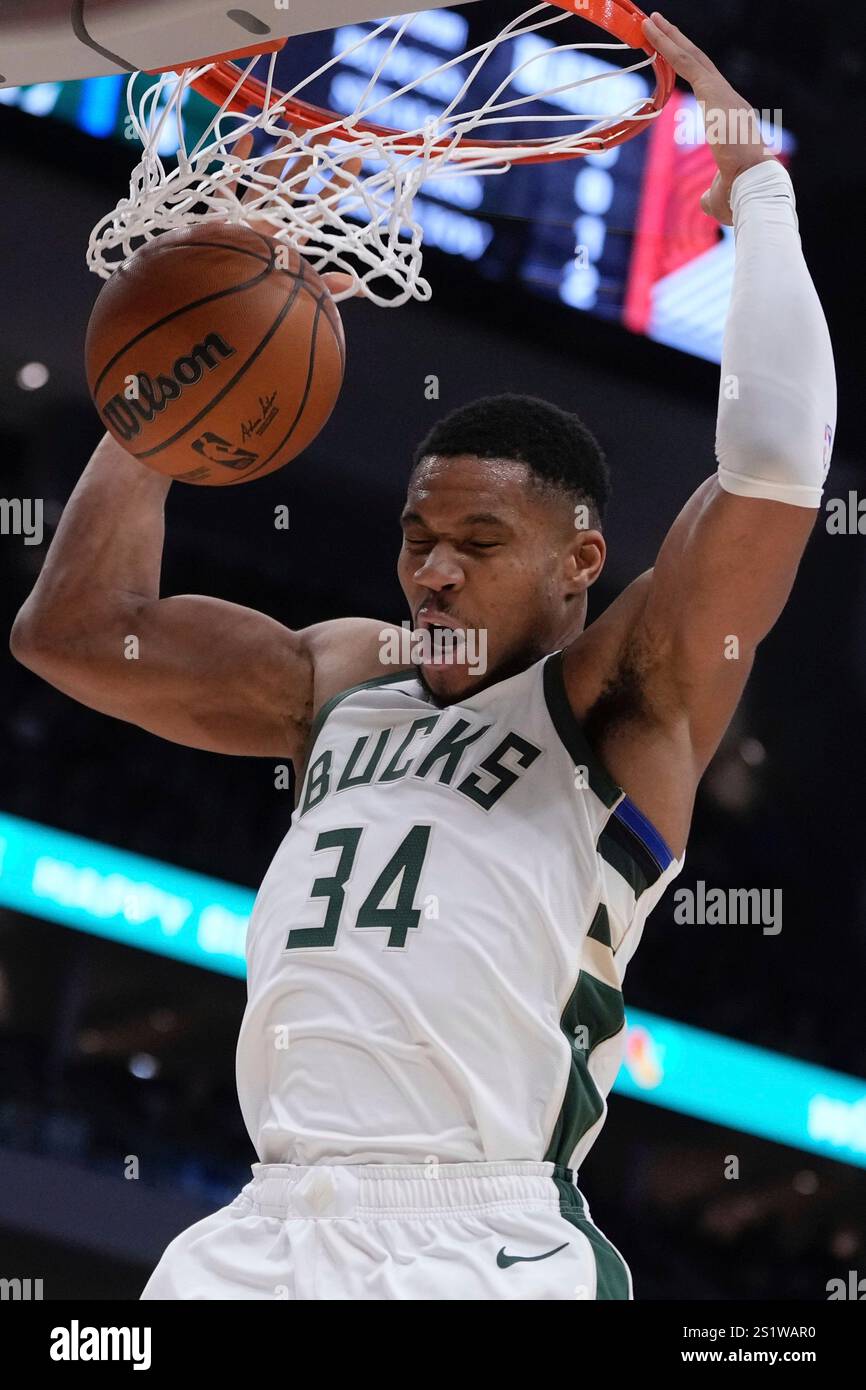Milwaukee Bucks' Giannis Antetokounmpo dunks during the first half of ...
