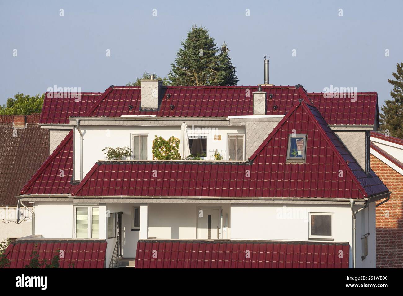 Modern residential building rear view with roof and balcony, apartment ...