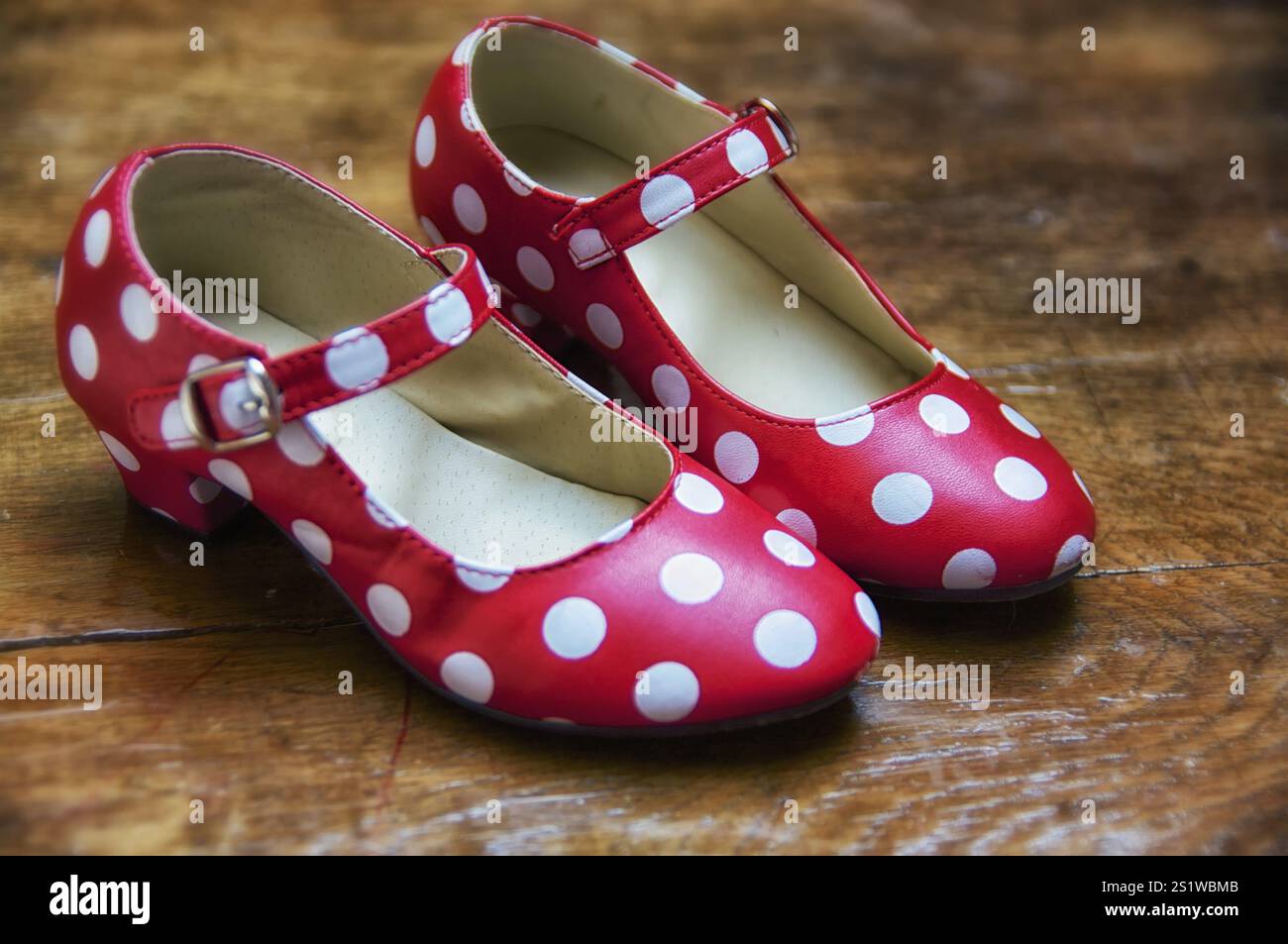 Red dance shoes with white dots Stock Photo - Alamy