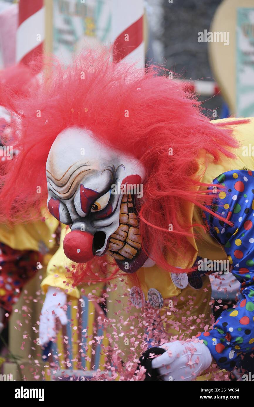 Aggressive clown mask with red hair and yellow costume for carnival ...