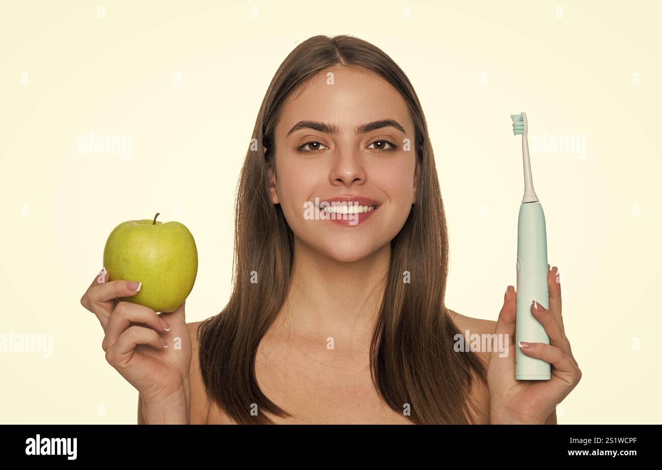 Electric toothbrush. Woman toothy smile isolated on white. Woman ...