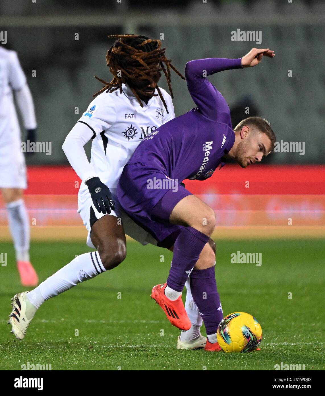 Florence, Italy. 4th Jan, 2025. Napoli's Frank Anguissa (L) vies with ...