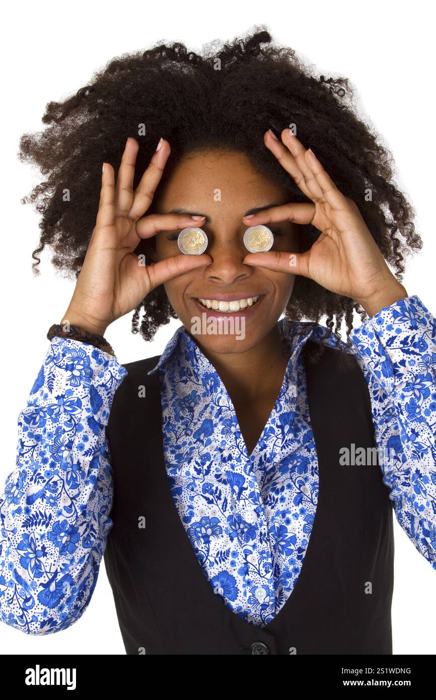 Attractive African-American woman holds two Ruro coins in front of her ...
