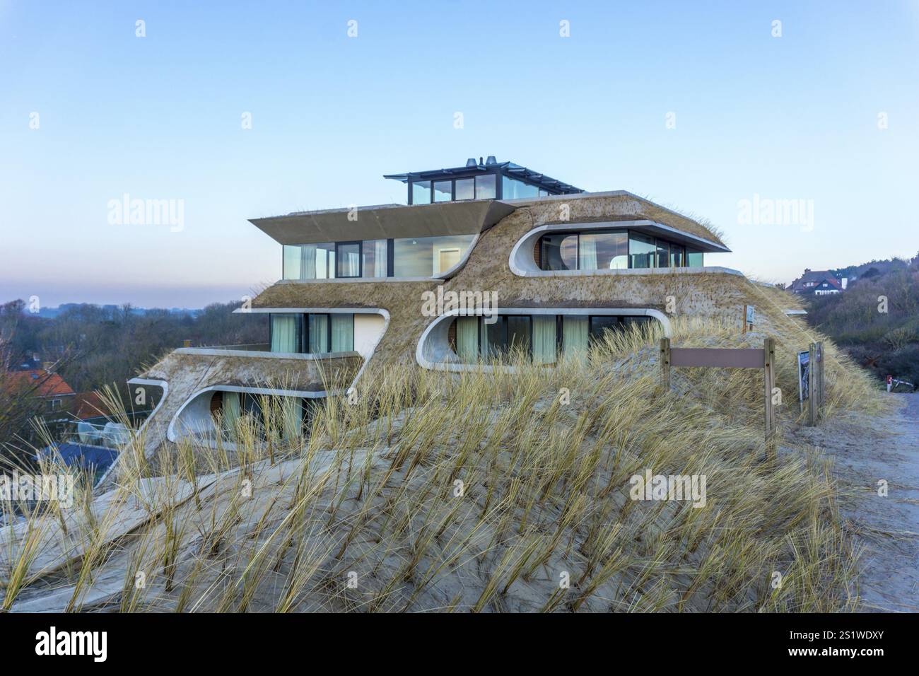 Modern building at the seaside, with a lot of windows and an ...