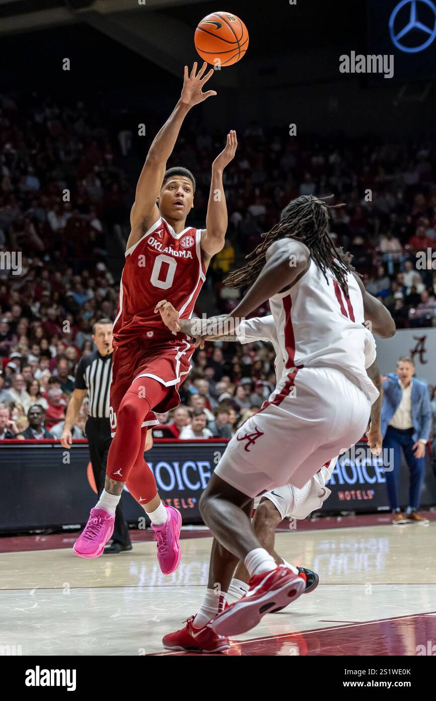 Oklahoma guard Jeremiah Fears (0) passes inside for an assist on a dunk ...