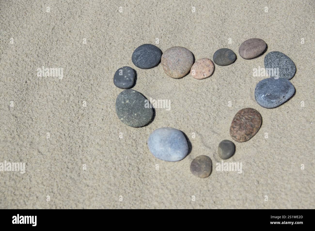 Round pebbles on the beach in Denmark is a symbol for balance. Stones ...