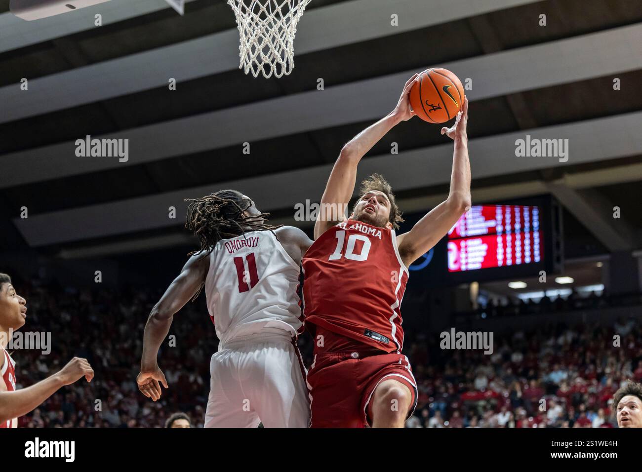 Oklahoma forward Sam Godwin (10) rebounds the ball past Alabama center ...