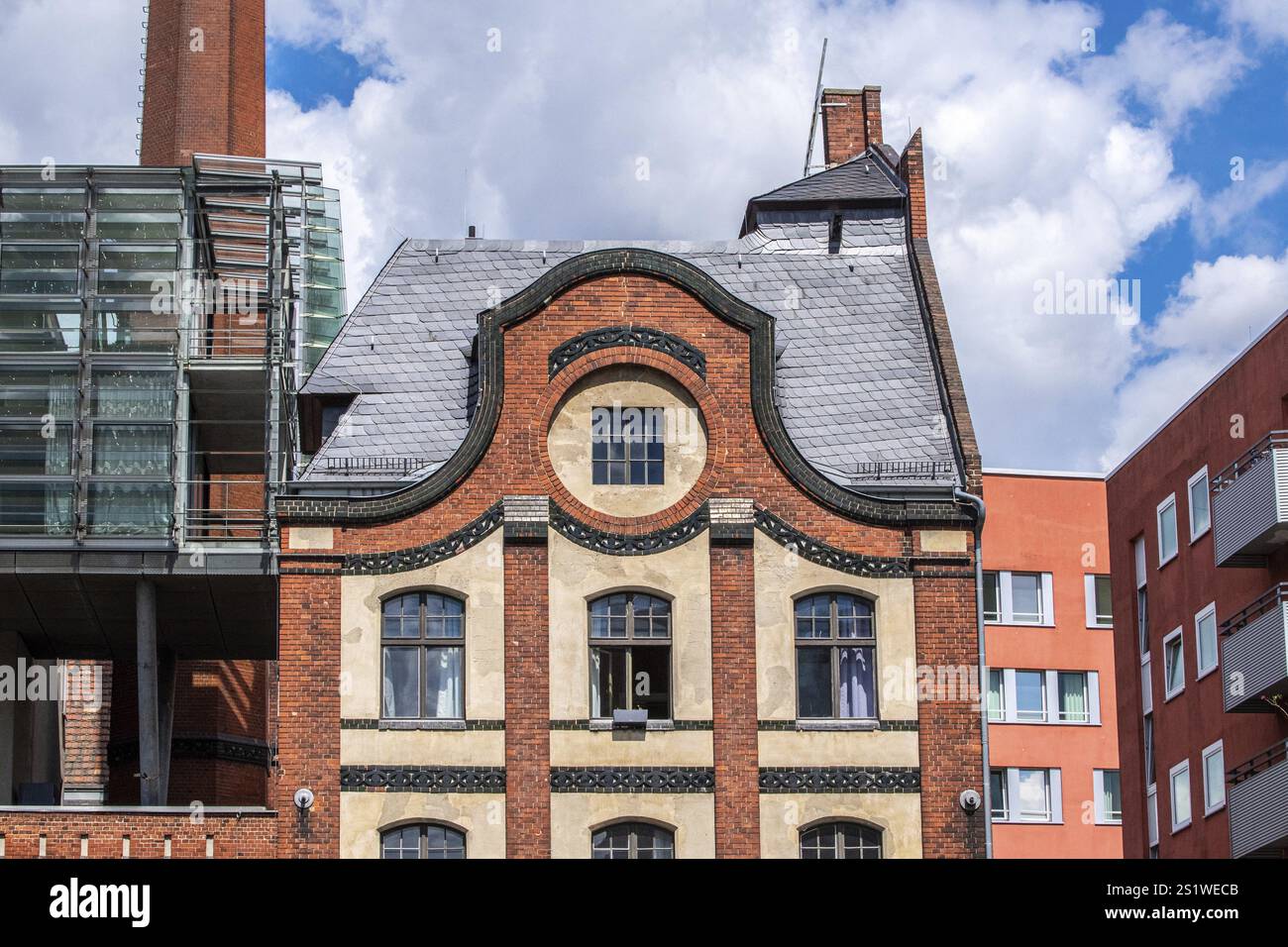 Interesting Berlin houses facade with brick and old windows. Stone ...