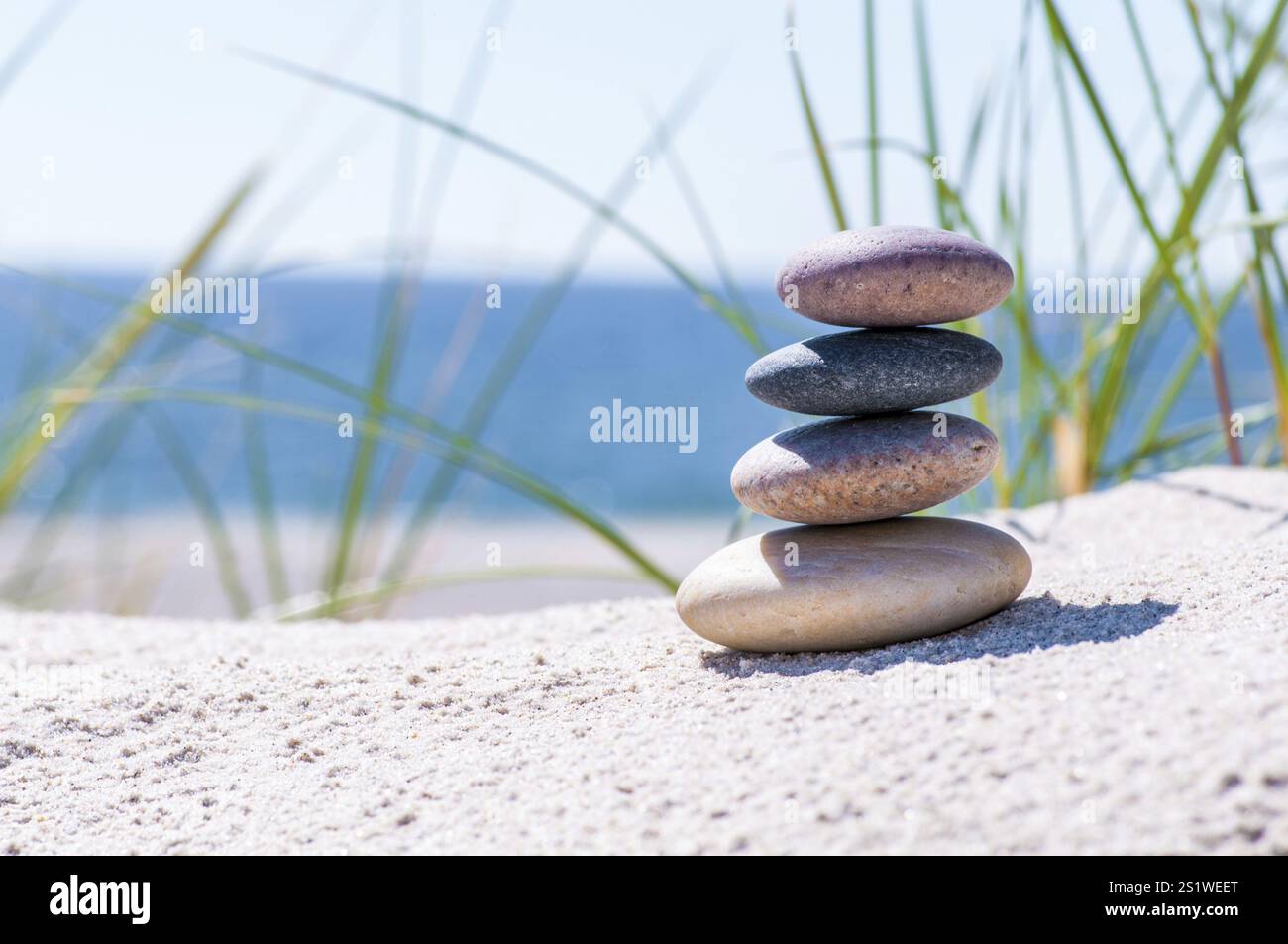 Round pebbles on the beach in Denmark is a symbol for balance. Stones ...