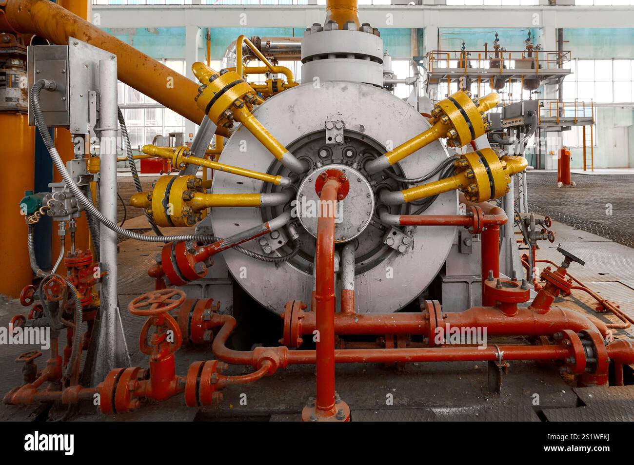 Powerful industrial pump operating within a chemical plant's facility ...