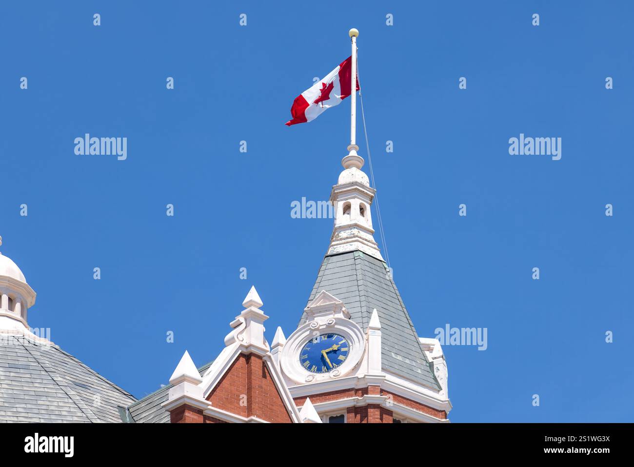 Red brick city hall with a clock tower in the scenic historic center in ...