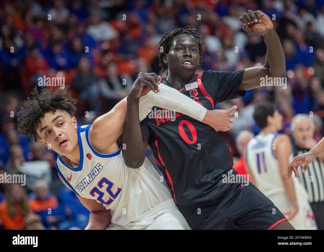 San Diego State's Magoon Gwath (0) fights for rebound position with ...