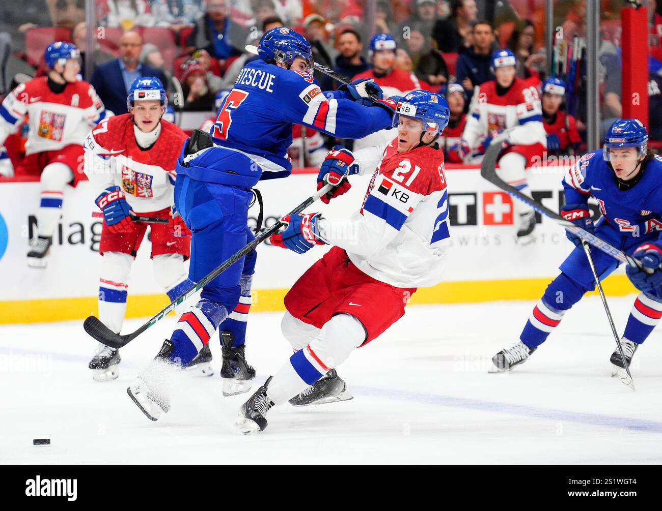 United States defenseman Drew Fortescue (5) checks Czechia forward ...