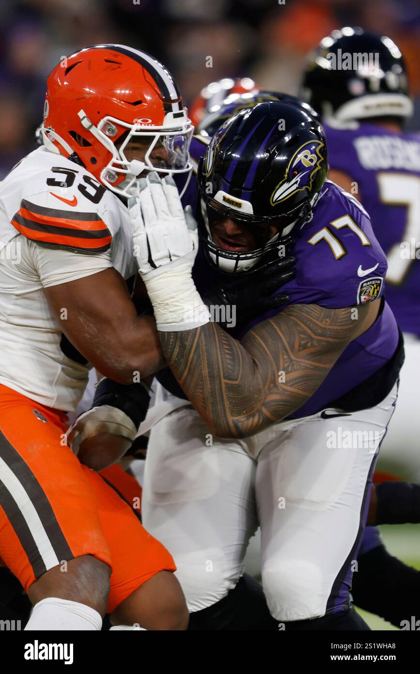 January 4, 2025: Baltimore Ravens guard Daniel Faalele (77) blocks ...
