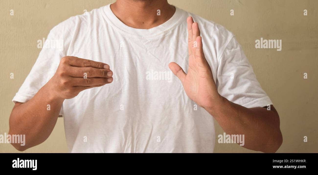 Young man deaf mute man showing number 500 using sign language Stock ...