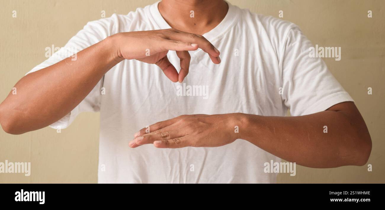 young man showing sign language with hand gestures speaking body ...