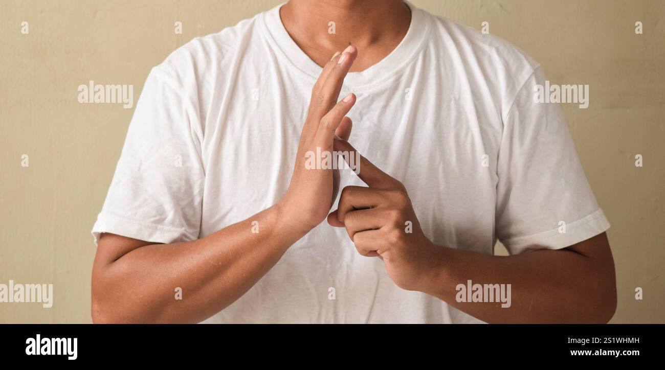 young man showing sign language with hand gestures speaking body ...