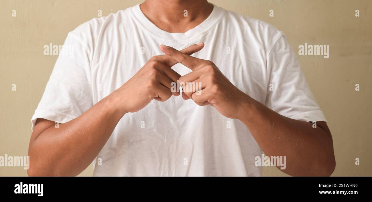 Young man raised hands being raised while speaking sign language ...