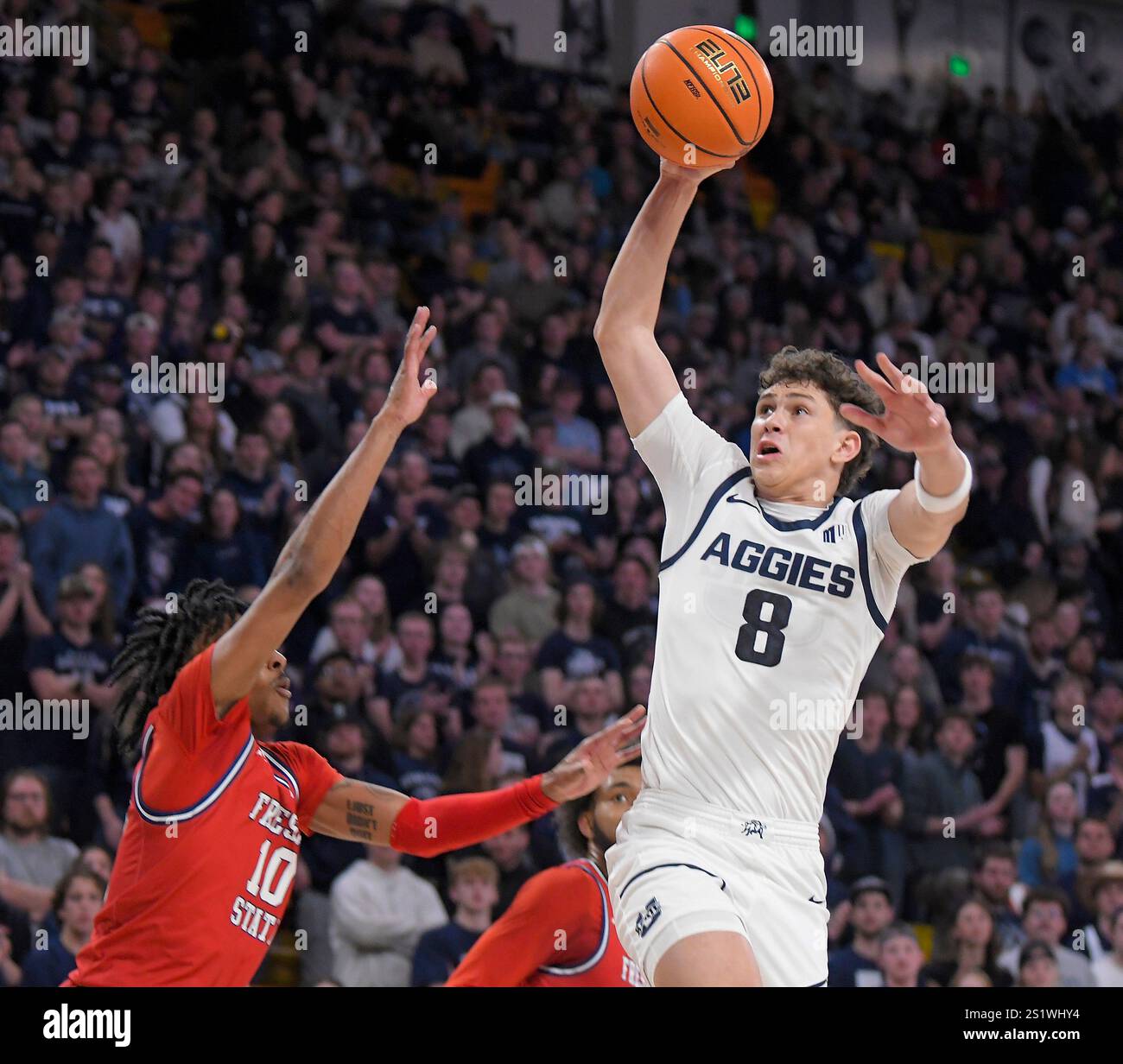 Utah State guard Drake Allen (8) drives to the basket as Fresno State ...