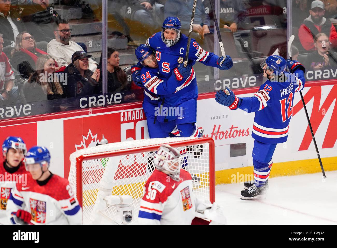 USA forward Ryan Leonard (9) celebrates his goal with teammates Gabe ...